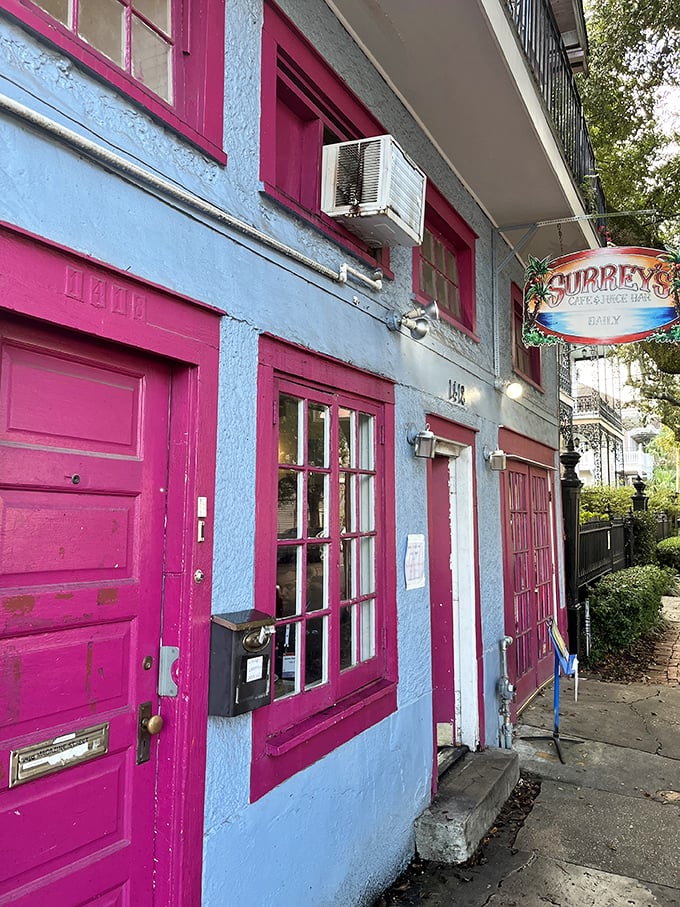 The pink-trimmed facade of Surrey's stands out on Magazine Street like a culinary beacon, promising breakfast treasures within those colorful walls.