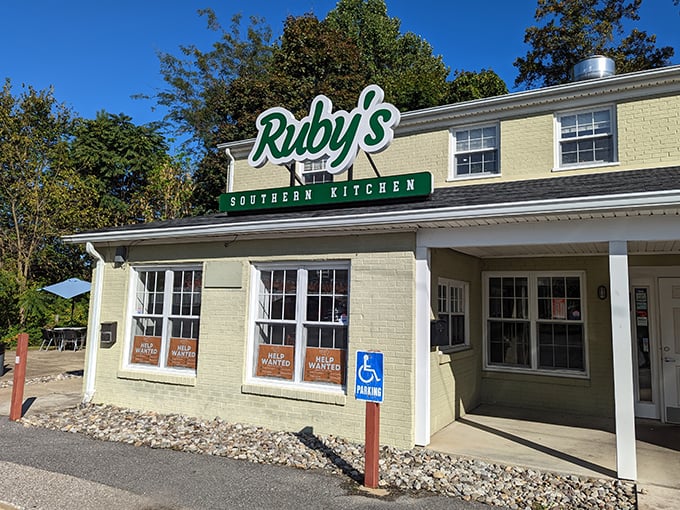 Ruby's glows like a beacon of Southern promise against the night sky, beckoning hungry travelers with its sleek exterior and warm lighting.