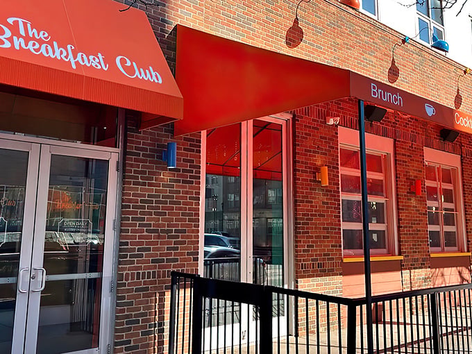 The vibrant red awning of The Breakfast Club MPLS beckons breakfast enthusiasts like a culinary lighthouse guiding hungry souls through Minneapolis mornings.