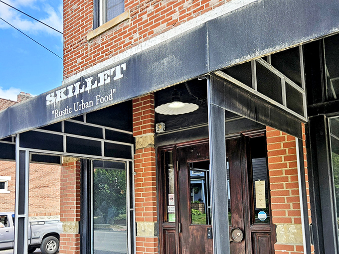 Skillet's unassuming brick exterior in Columbus hides culinary treasures within. The black awning whispers promises that the food inside shouts from the rooftops.