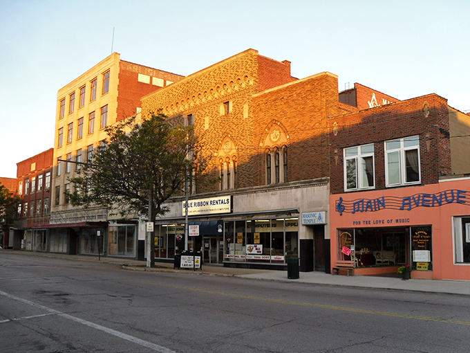 Main Avenue's historic buildings catch the golden hour sunlight, a scene that makes you wonder if Norman Rockwell moonlighted as a city planner.