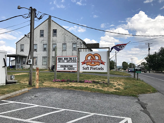 The unassuming white farmhouse exterior of Dutch Country Soft Pretzels stands as Pennsylvania's temple to twisted dough, where pretzel pilgrims have journeyed for decades.