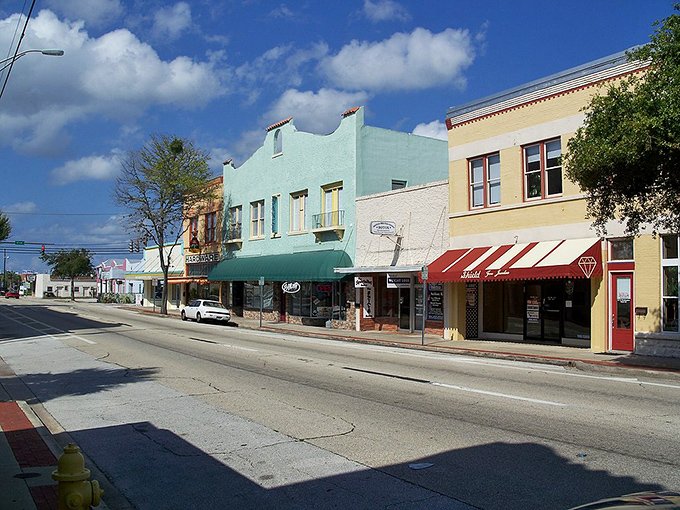 Downtown Titusville glows with warm possibility at night, where historic buildings and palm trees create an affordable slice of Florida paradise. 