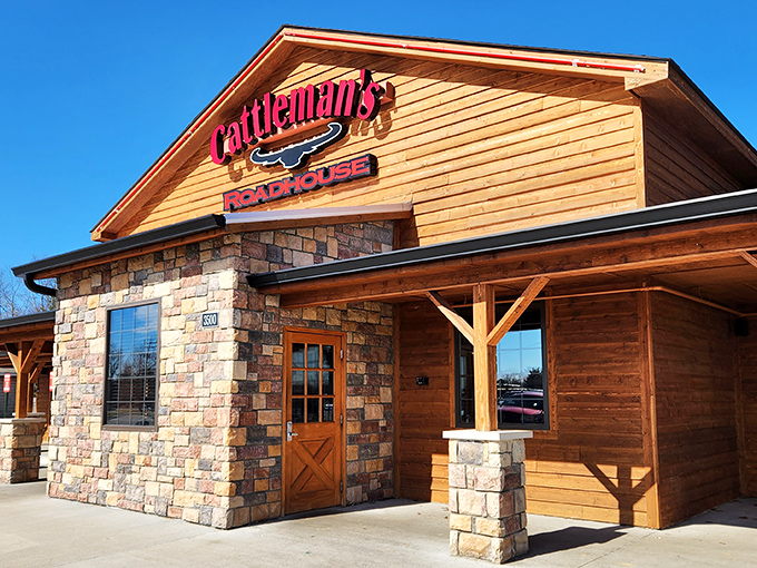 The rustic wood-and-stone exterior of Cattleman's Roadhouse promises what every great steakhouse should: a place where carnivores can feel right at home.