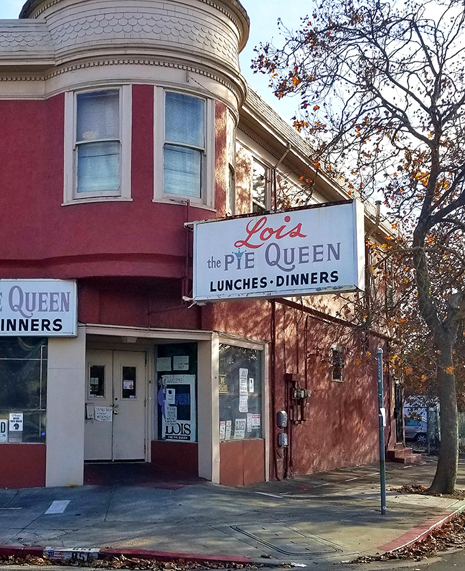 The pink corner building that houses Lois the Pie Queen stands as an Oakland landmark, promising Southern comfort in California sunshine.