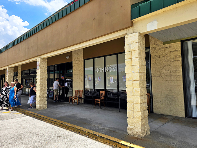 Nonno's welcomes hungry travelers with its cheerful red signage, like a beacon of Italian comfort food in a Florida strip mall. 