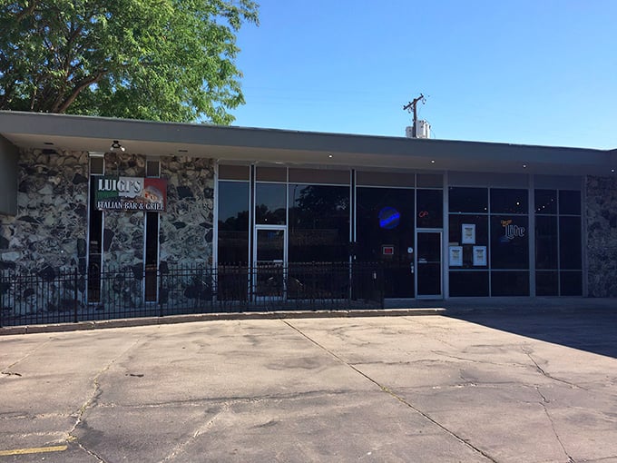 Luigi's stone facade creates that perfect "discovered gem" vibe, complete with the iconic Leaning Tower signage that promises authentic Italian flavors in Nebraska.