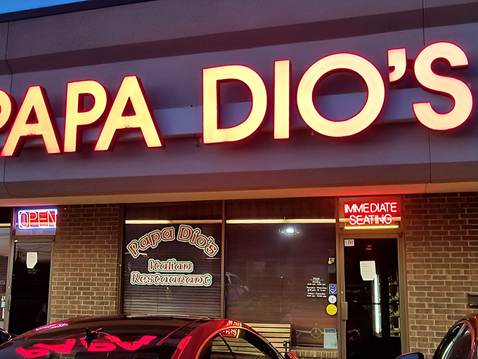 The glowing red sign beckons like a lighthouse for the pasta-starved. No fancy frills, just the promise of authentic Italian goodness waiting inside.
