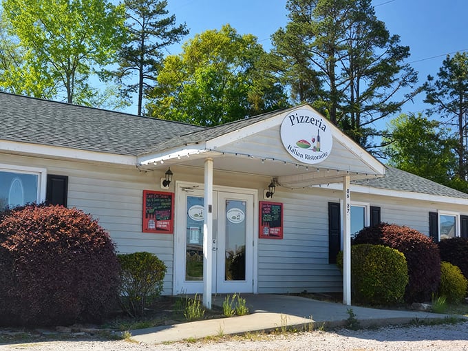 The unassuming exterior of Rizzo's might fool you, but those string lights are practically whispering, "Come inside for the good stuff."