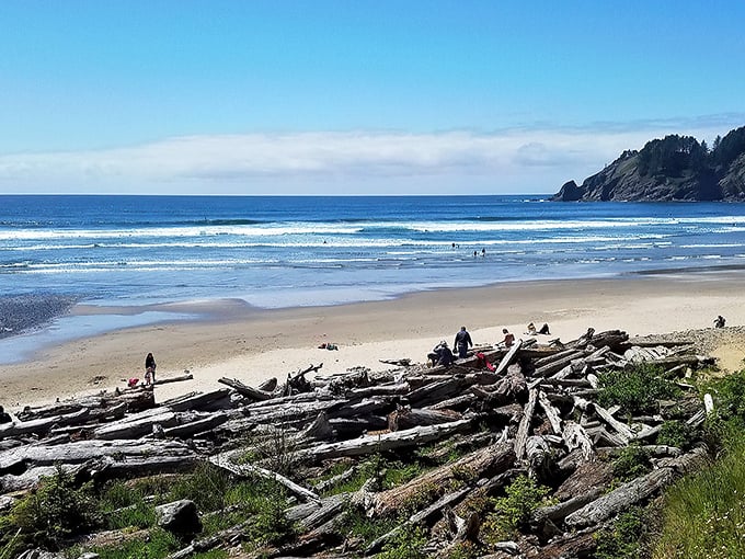 Nature's perfect amphitheater awaits at Short Sand Beach, where towering headlands cradle golden sands like they're protecting Oregon's best-kept secret.