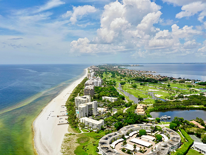 Paradise from above! Longboat Key's slender silhouette stretches between turquoise Gulf waters and Sarasota Bay, a living postcard of coastal perfection.