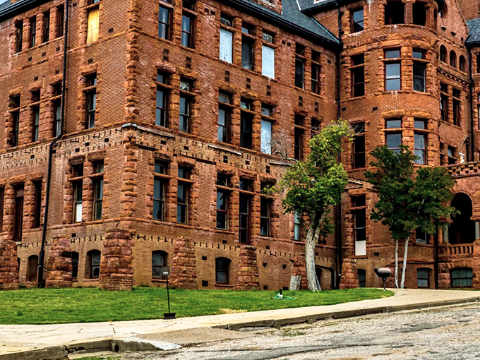 The imposing red brick facade of Preston Castle stands as a magnificent time capsule, its Romanesque revival architecture creating an unexpected European silhouette against California's golden foothills.
