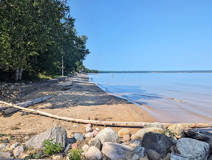 Lake Superior stretches to the horizon like nature's infinity pool, with driftwood sculptures that would make gallery owners jealous.