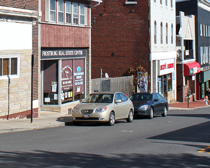 Main Street stretches before you like a Norman Rockwell painting come to life, where traffic jams involve three cars and everyone waves.