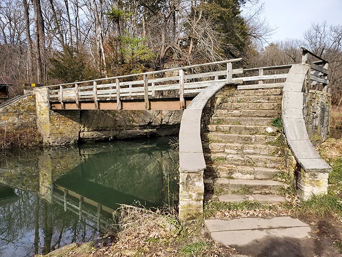 The stone bridge at White Pines stands like a miniature medieval fortress, where hiking trails and daydreams converge above Pine Creek's gentle flow.