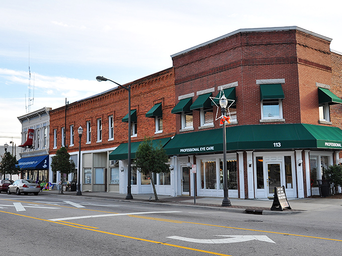Highway junction signs create a roadmap of possibilities in Benson, where the crossroads of small-town charm and convenience meet under Carolina's generous sky.