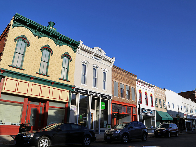 Colorful facades tell stories of a bygone era along Delphos's Main Street, where historic architecture meets small-town charm under impossibly blue Ohio skies.