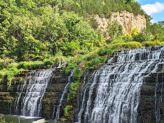 Nature's perfect staircase &ndash; Thunder Bay Falls cascades down limestone shelves, creating a mesmerizing display that hypnotizes visitors and silences even the chattiest companions.