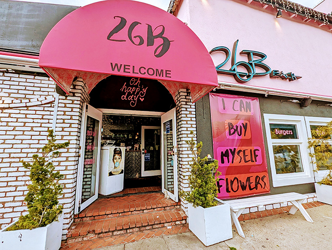 The iconic pink awning of 26 Beach welcomes you with a cheerful "Oh happy day!" message. Self-care starts here, one French toast at a time.
