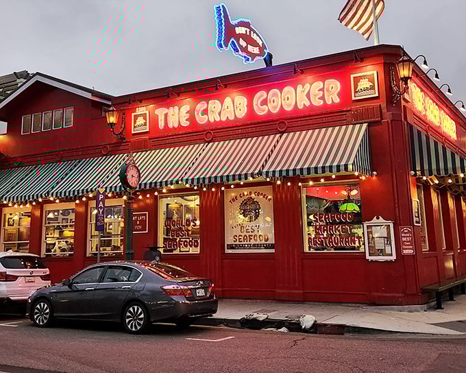 The bright red exterior of The Crab Cooker glows like a culinary lighthouse, beckoning seafood lovers to Newport Beach's most unpretentious treasure.