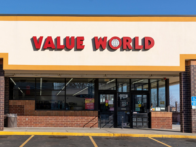 The iconic red Value World sign beckons like a lighthouse for bargain hunters. This unassuming storefront houses treasures waiting to be discovered.