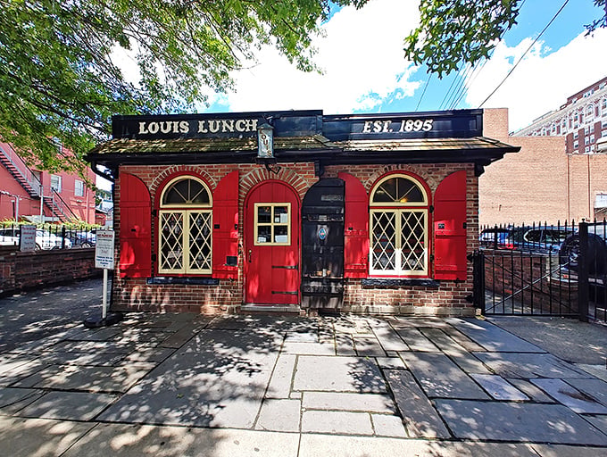 The little red brick building that changed America's culinary landscape forever. Louis' Lunch stands proudly in New Haven, a burger shrine disguised as a modest diner.