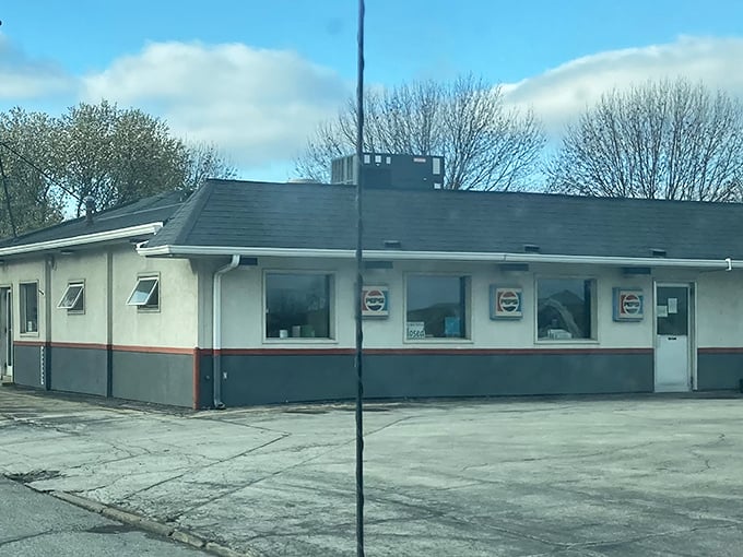 The iconic Maid-Rite sign beckons hungry travelers like a midwestern lighthouse, promising comfort food that's stood the test of time.