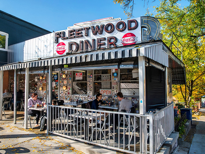 The iconic silver exterior of Fleetwood Diner gleams in the Michigan sunshine, a time capsule of Americana where hungry souls find refuge 24/7.