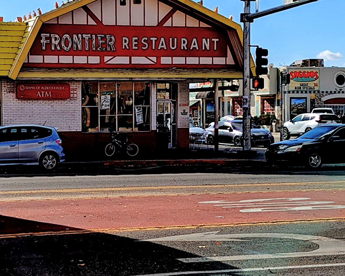 The iconic red and white facade of Frontier Restaurant glows like a beacon for hungry souls wandering Central Avenue after dark.