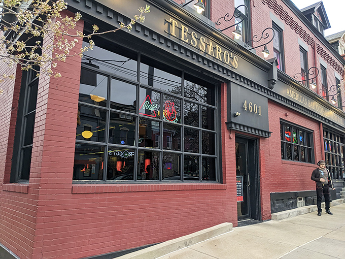 The brick-red facade of Tessaro's stands like a beacon of burger hope on Liberty Avenue, promising carnivorous delights within those historic walls.