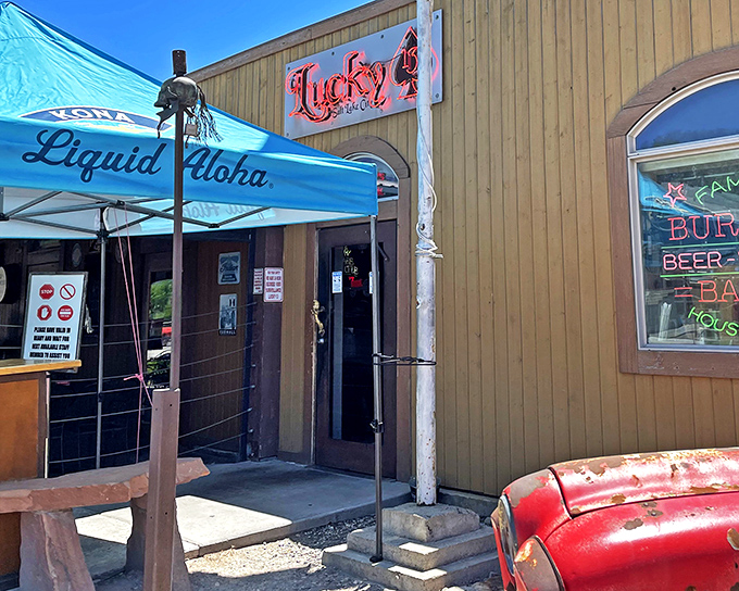 The unassuming wooden exterior of Lucky 13 promises little but delivers everything. That "Liquid Aloha" umbrella is practically winking at you.