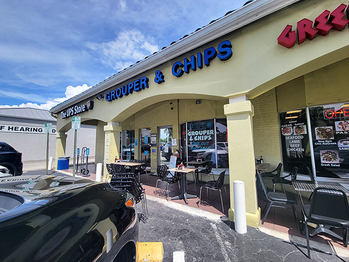 The unassuming exterior of Grouper & Chips, with its bright blue roof and yellow walls, proves once again that culinary treasures often hide in plain sight.