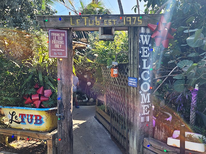 The unassuming wooden fence and yellow sign of Le Tub are Florida's version of a speakeasy entrance&mdash;secrets and seafood await behind these weathered boards.