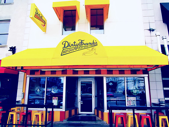 The cheerful red and yellow awning of Dirty Frank's beckons like a hot dog lighthouse, guiding hungry souls to wiener paradise since 2009.