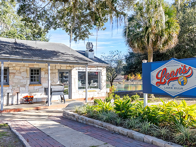 Spanish moss drapes over Lake Ella like nature's own chandelier, creating the perfect backdrop for Leon's magical outdoor dining experience.