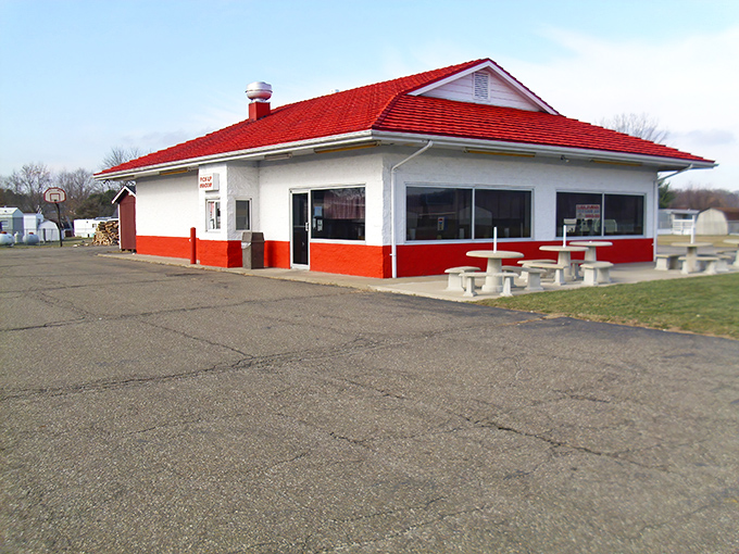 The iconic red-roofed building stands like a BBQ beacon, promising smoky delights to hungry travelers passing through Nashport.