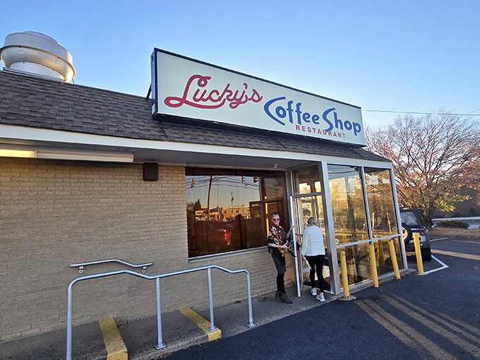 That iconic sign beckons like an old friend, promising comfort food and conversations that'll last longer than your coffee.