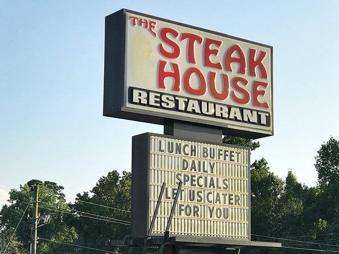 The welcoming brick exterior with its distinctive green roof promises comfort before you even step inside. Southern hospitality starts at the front door.