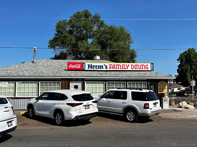 The unassuming exterior of Norm's Family Dining stands like a beacon of breakfast hope in Twin Falls, where pancake pilgrimages begin beneath that iconic red Coca-Cola sign.
