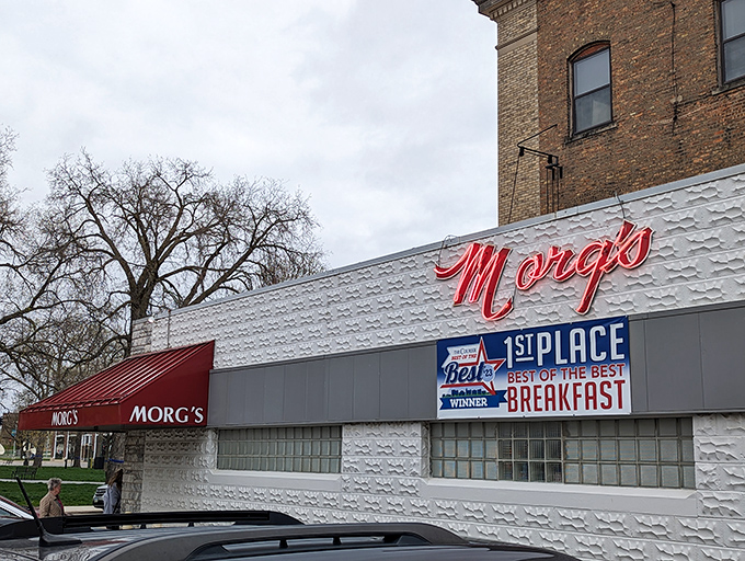 Morg's iconic white building with its bold red script sign stands as a beacon of breakfast hope on Mulberry Street in Waterloo.