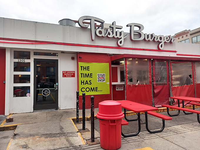 The neon glow of Tasty Burger's sign against the twilight sky beckons like a lighthouse for the hungry and flavor-deprived. Boston's answer to late-night cravings.