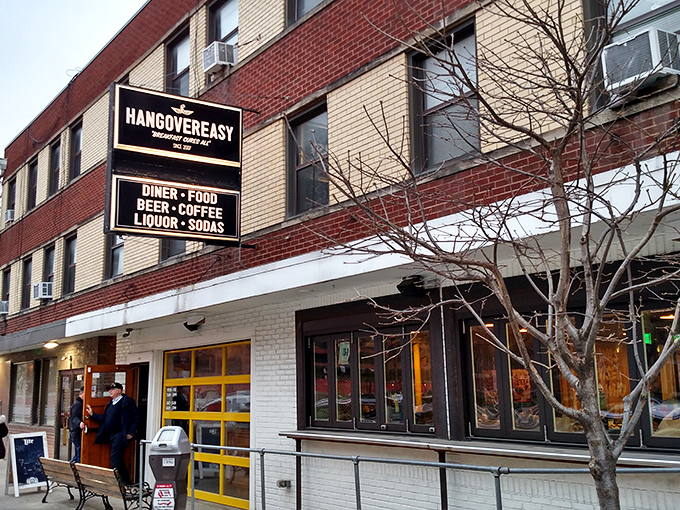 The iconic red door and yellow windows of HangOverEasy beckon like a breakfast lighthouse on Columbus's Neil Avenue, promising delicious salvation for hungry souls.
