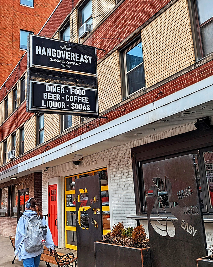 The iconic red door and yellow windows of HangOverEasy stand out like a beacon of breakfast hope on Neil Avenue. Morning salvation awaits inside.