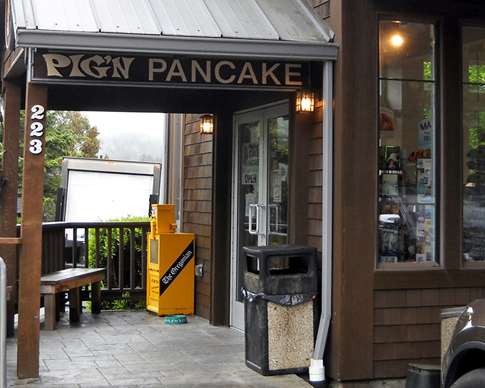 The quintessential Oregon coast welcome! Pig 'N Pancake's rustic timber exterior promises comfort food salvation after a brisk morning beach walk.
