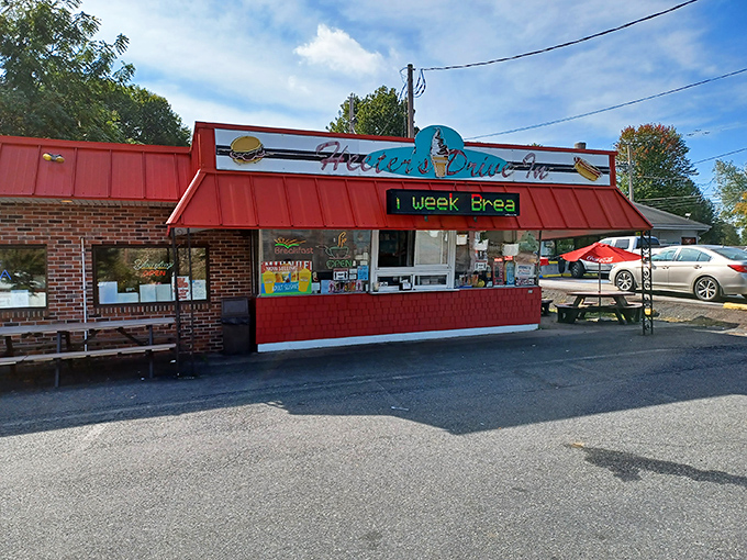Twilight transforms this humble brick building into a beacon of comfort food promise. The red roof glows like a dinner bell calling hungry travelers home.