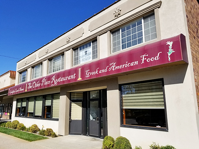 The unassuming exterior of The Other Place Restaurant proves that culinary treasures often hide behind modest facades. Greek greatness awaits inside!