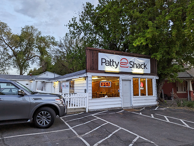 The classic white exterior with that vintage sign promises no-frills perfection. That red Thunderbird knows what's up. 