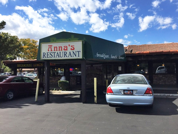 Anna's iconic green-roofed entrance beckons hungry travelers like a breakfast lighthouse on the shores of suburban Murray. The stone fa&ccedil;ade promises comfort within.
