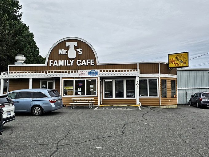The arched brown exterior of Mr. T's stands like a beacon of breakfast hope along the highway, promising pancake perfection within those humble walls.