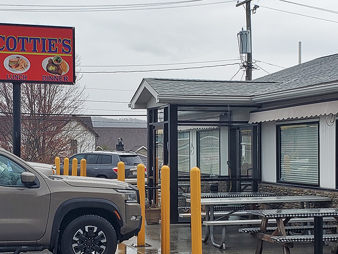 Simplicity speaks volumes at Scottie's exterior, where that iconic red sign promises hamburger heaven against West Virginia's rolling hills.